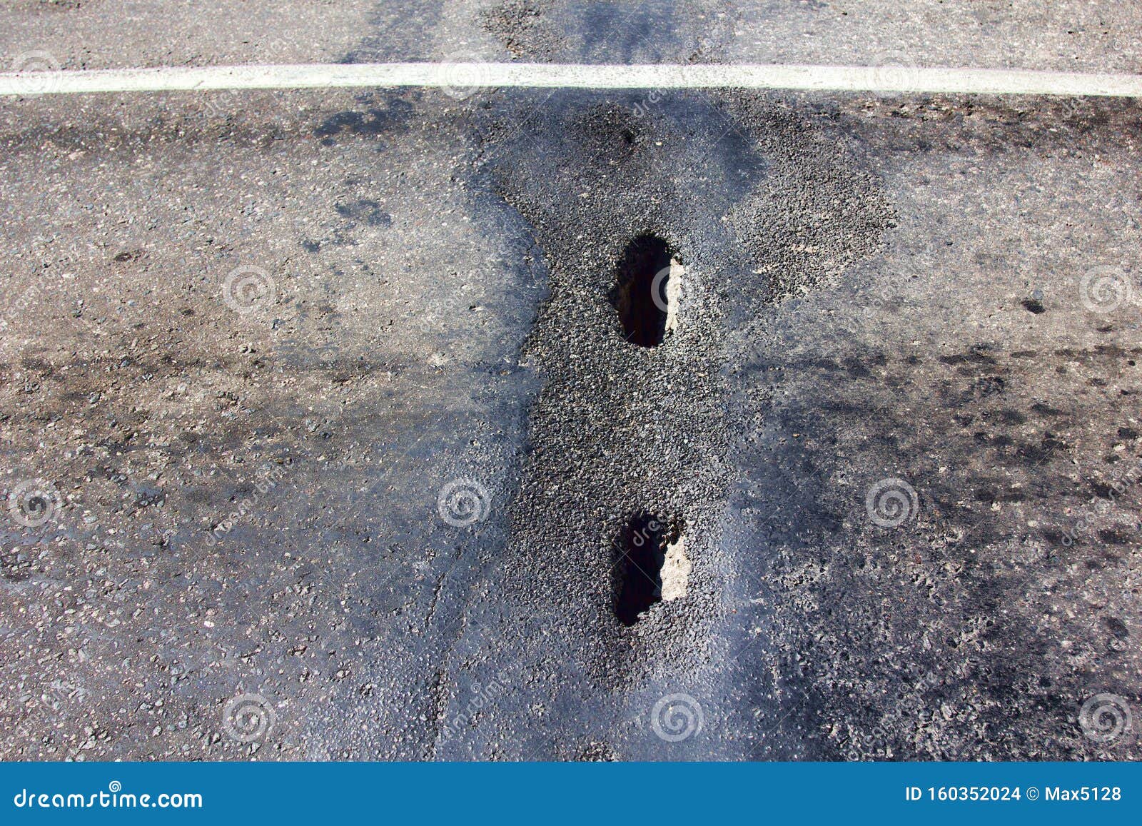 A Pot Hole in the Asphalt Road in Need of Maintenance Stock Photo ...