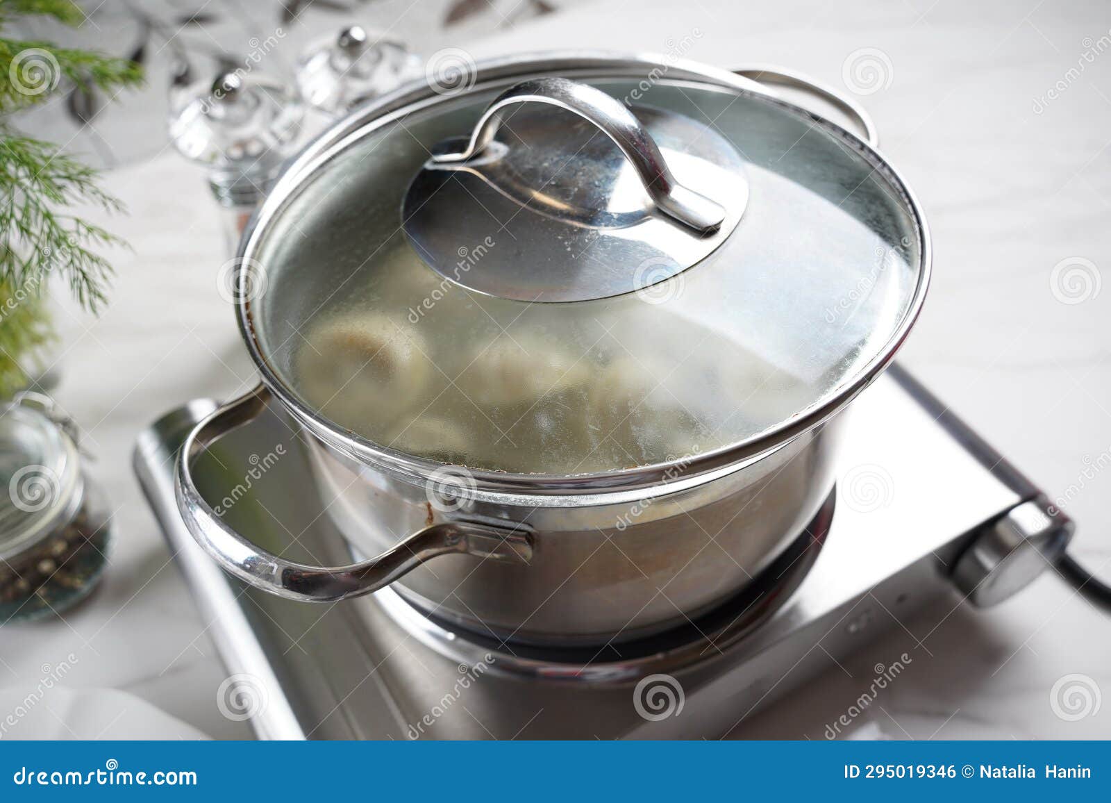 Pot with Lid Full of Dumplings in Boiling Water. Stock Photo - Image of ...