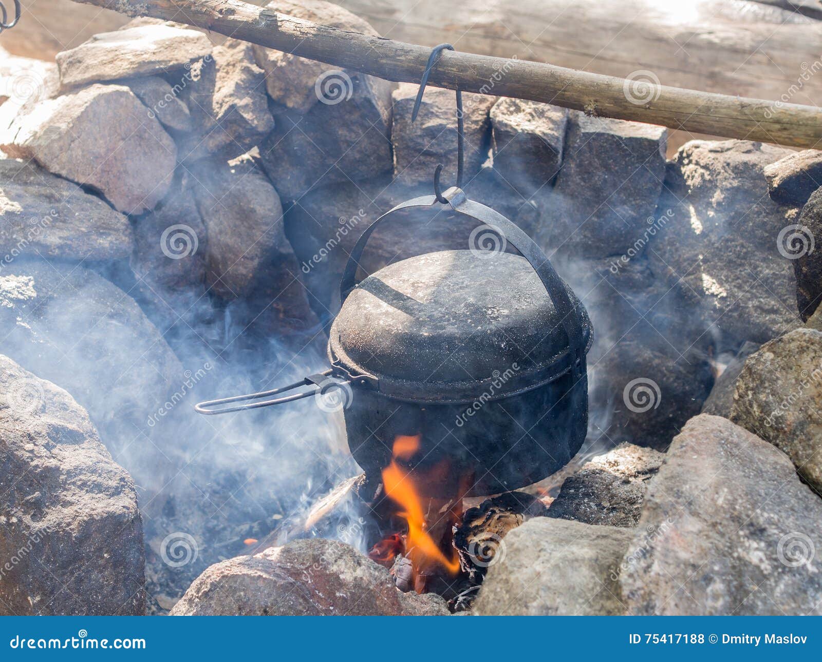 Pot over a fire stock photo. Image of heat, wood, stone - 75417188