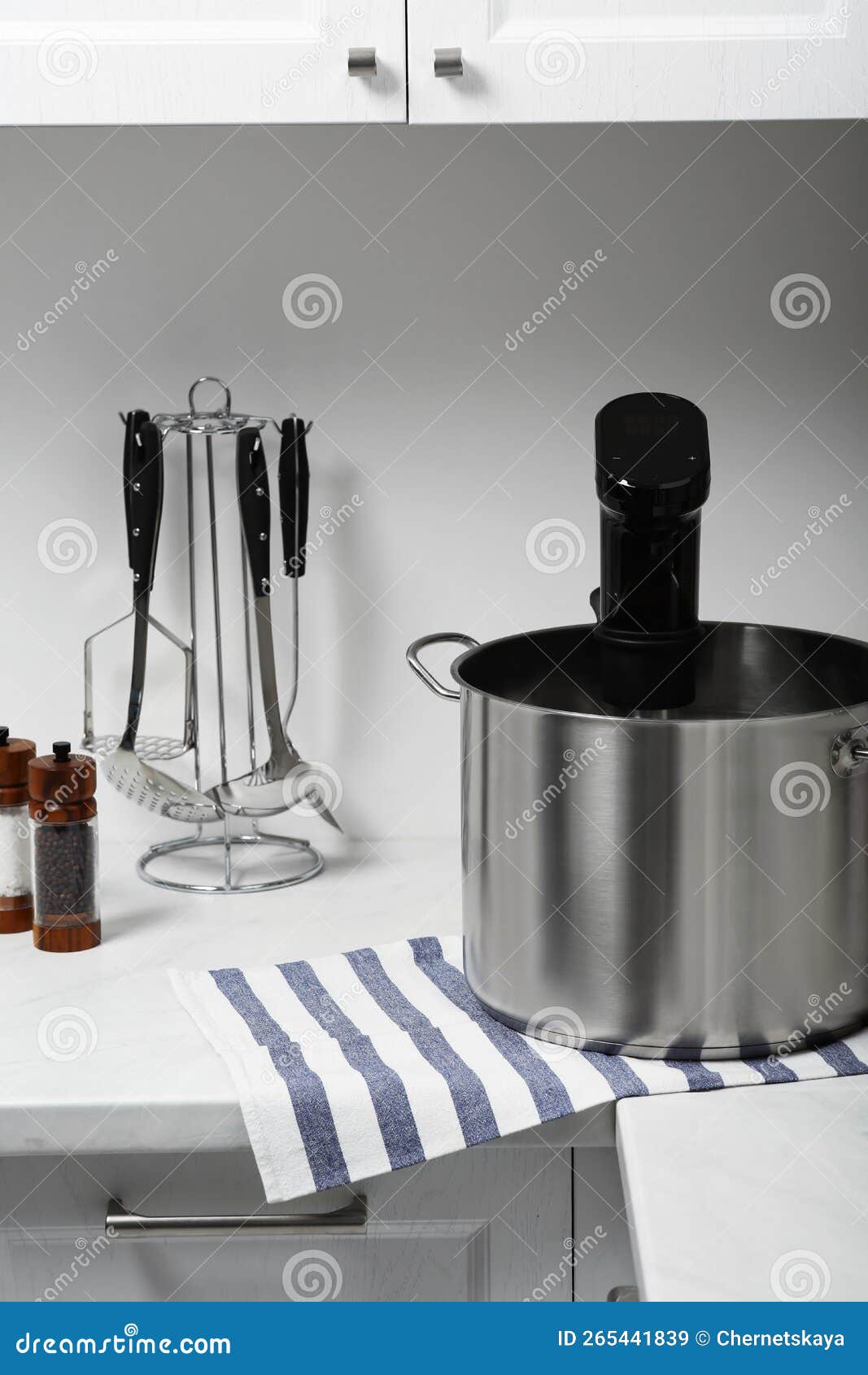 Pot with Sous Vide Cooker in Kitchen. Thermal Immersion Circulator ...