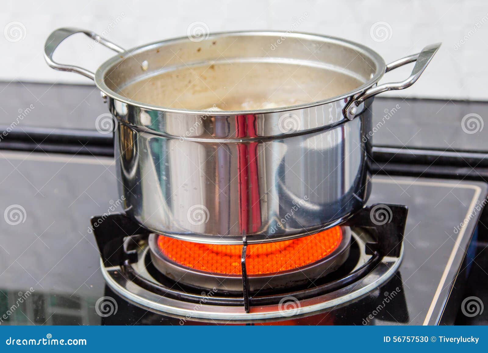 Pot on stove stock photo. Image of cooker, fire, colander - 56757530