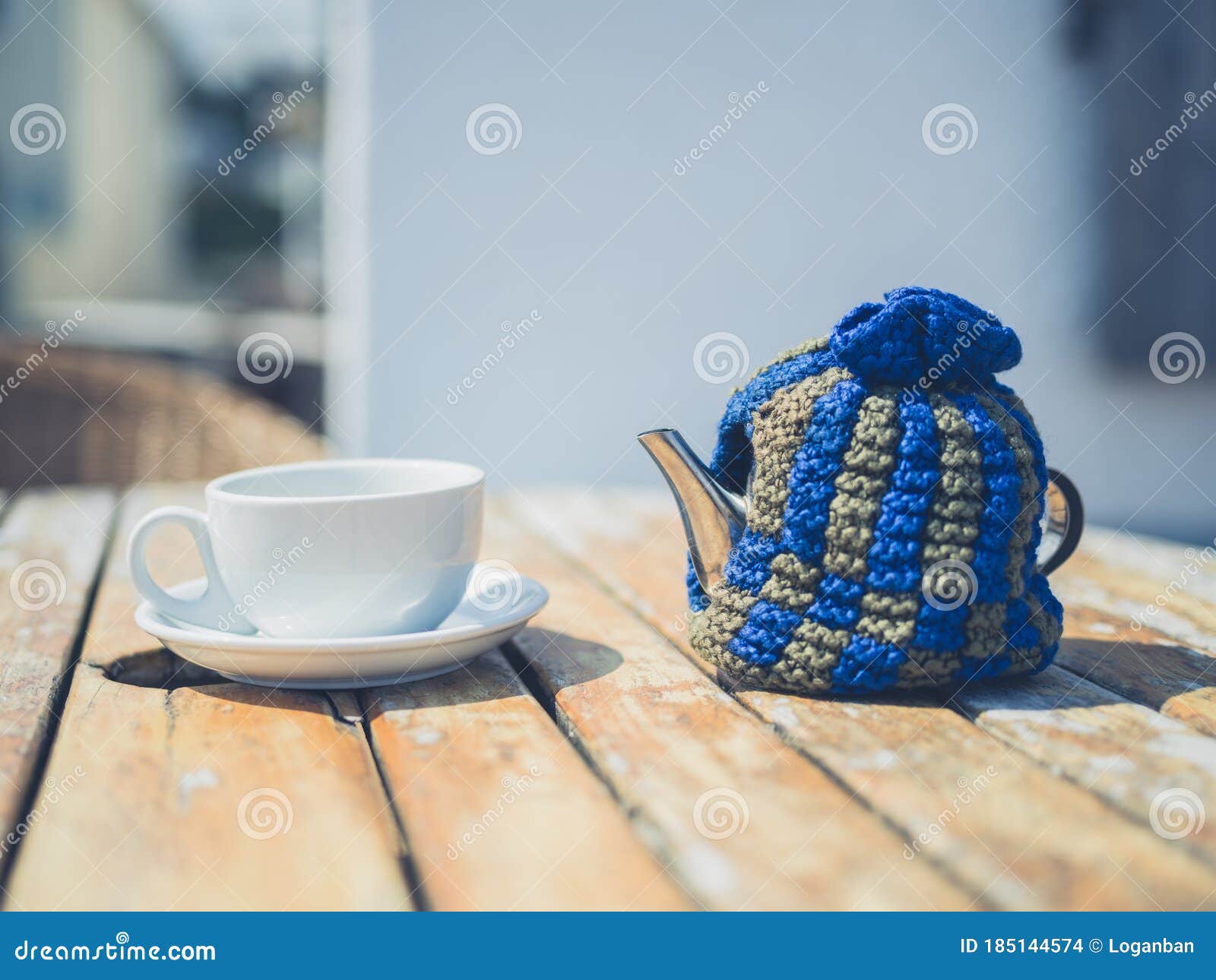 Pot of tea and cup outside stock photo. Image of drink - 185144574