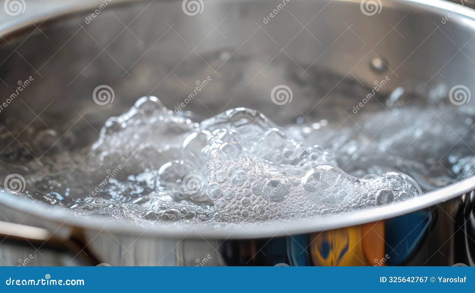 A Pot of Water at a Rolling Boil with Bubbles Rapidly Rising To the ...