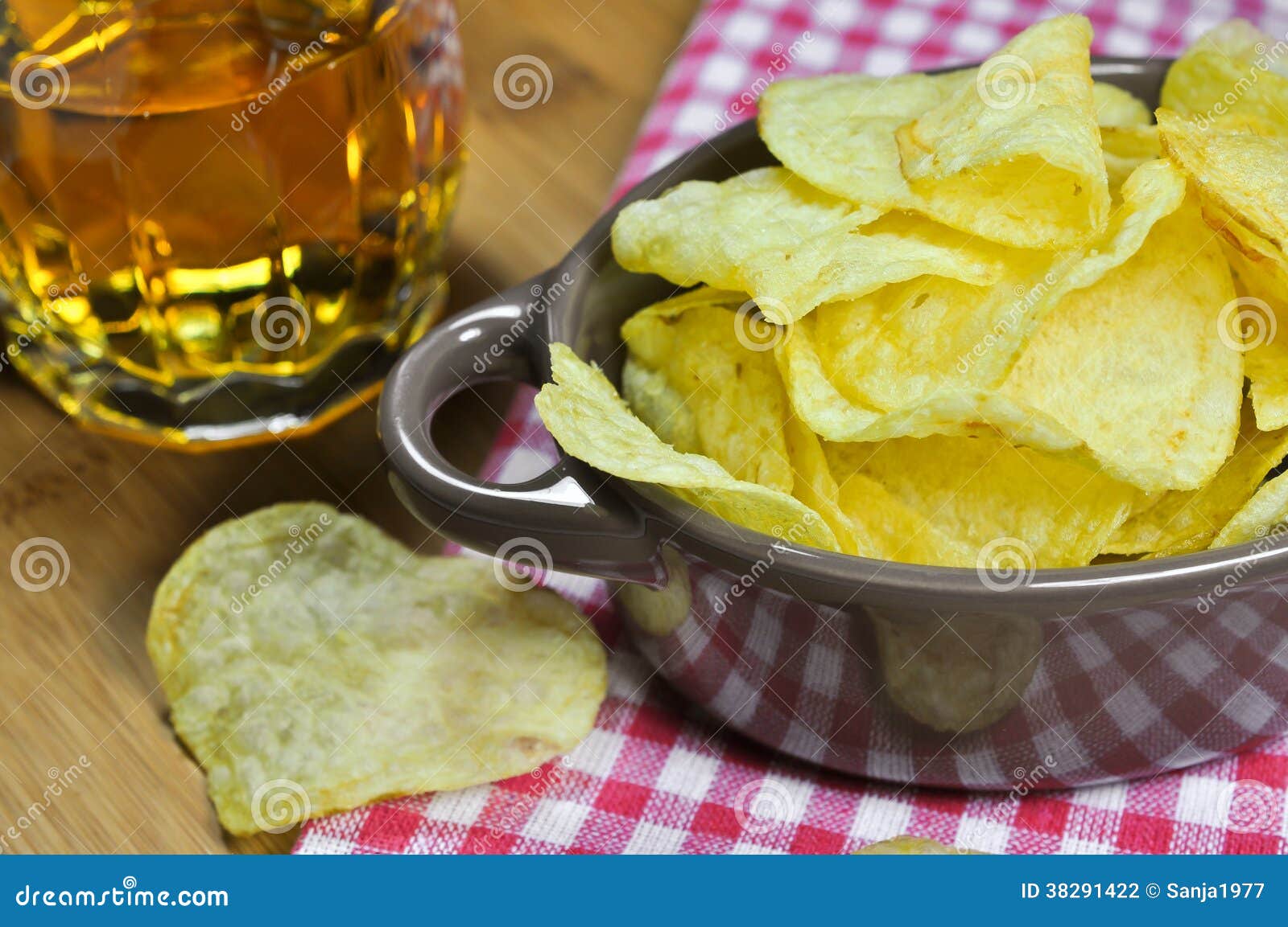 Potato chips and beer stock photo. Image of appetizer - 38291422