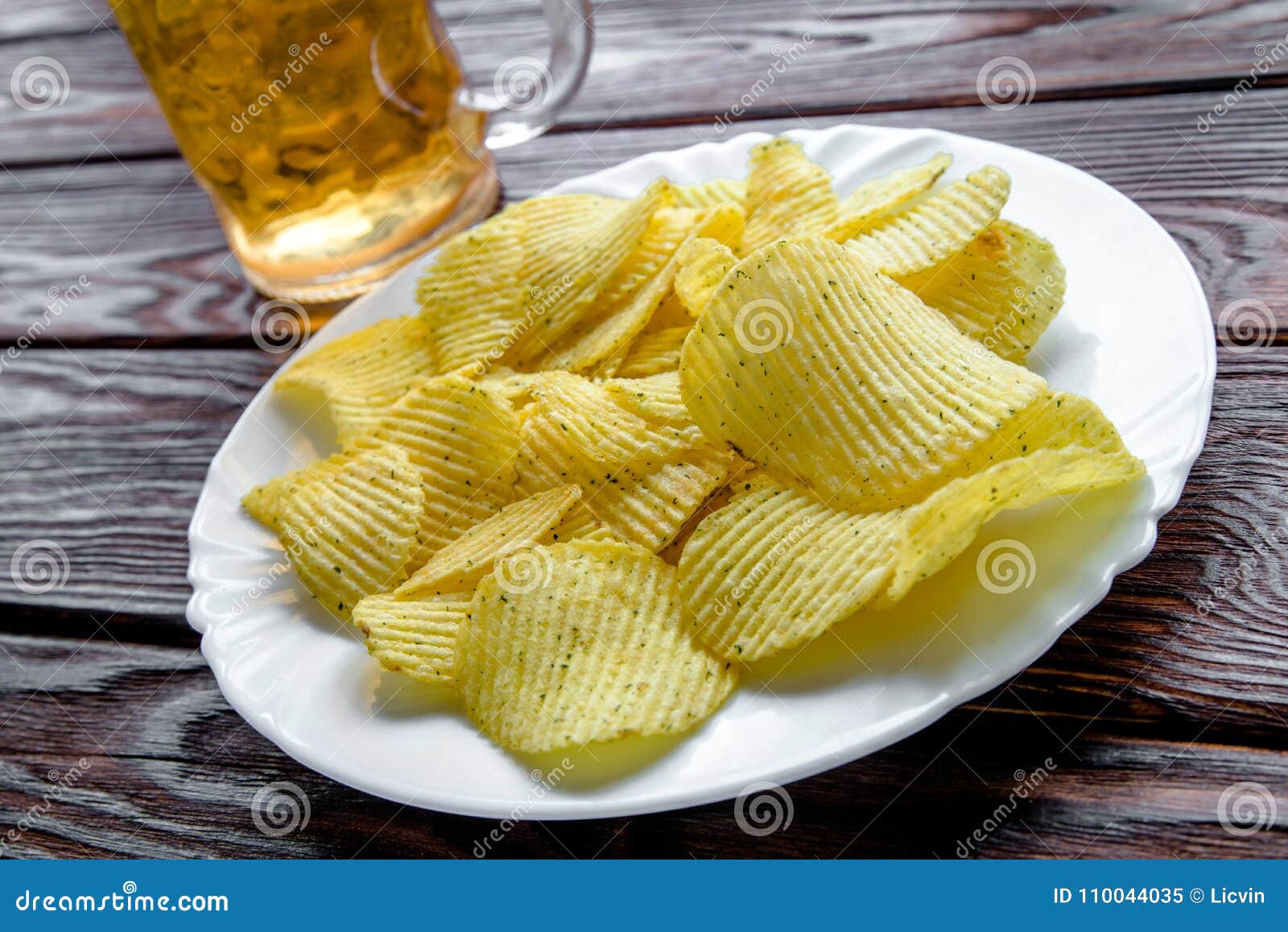 Potato chips and beer stock image. Image of table, lager - 110044035