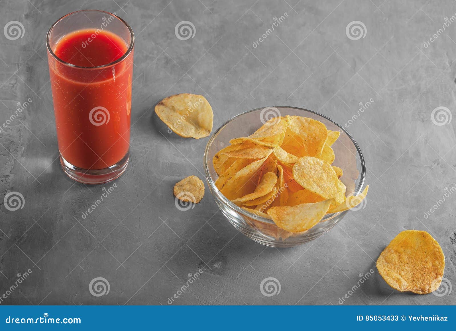 Potato Chips in Bowl with a Tomato Juice in Glass Stock Image - Image ...