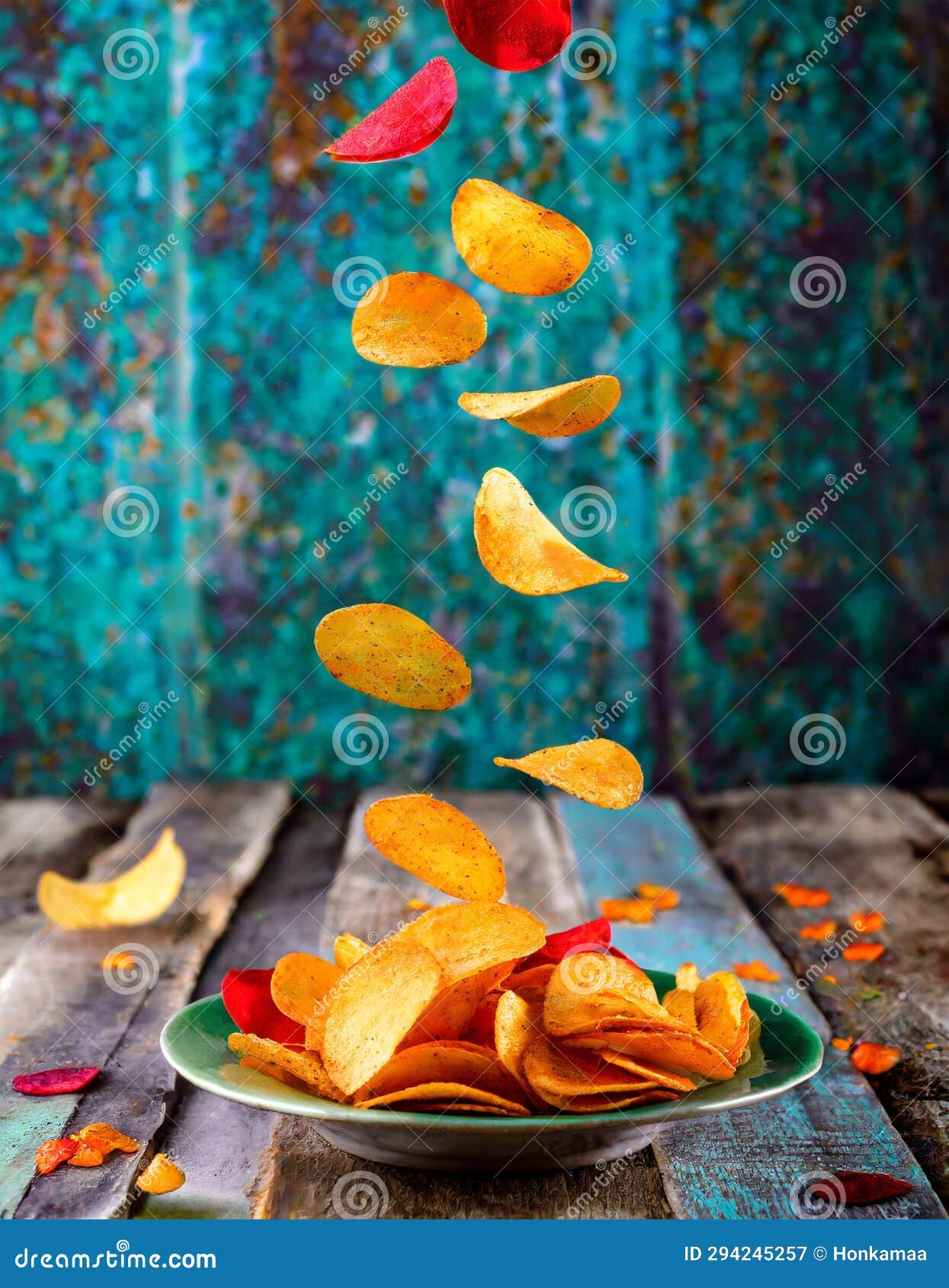 Potato Chips Falling Down on an Old Rustic Wooden Table Stock ...