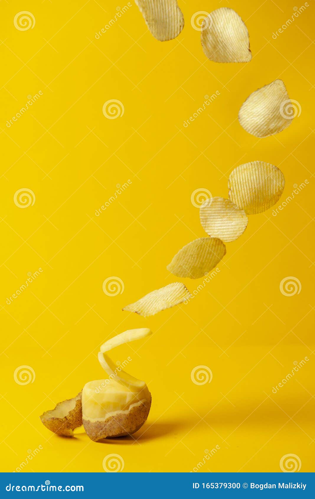 Potato Chips Fly on a Yellow Background, the Process of Making Chips ...