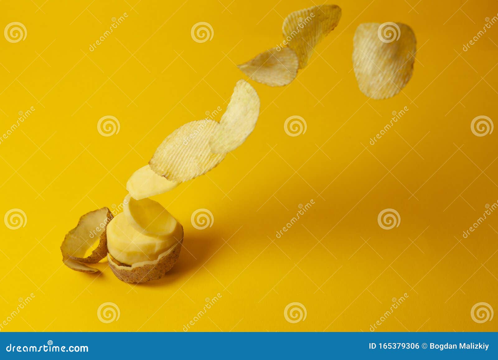 Potato Chips Fly on a Yellow Background, the Process of Making Chips ...