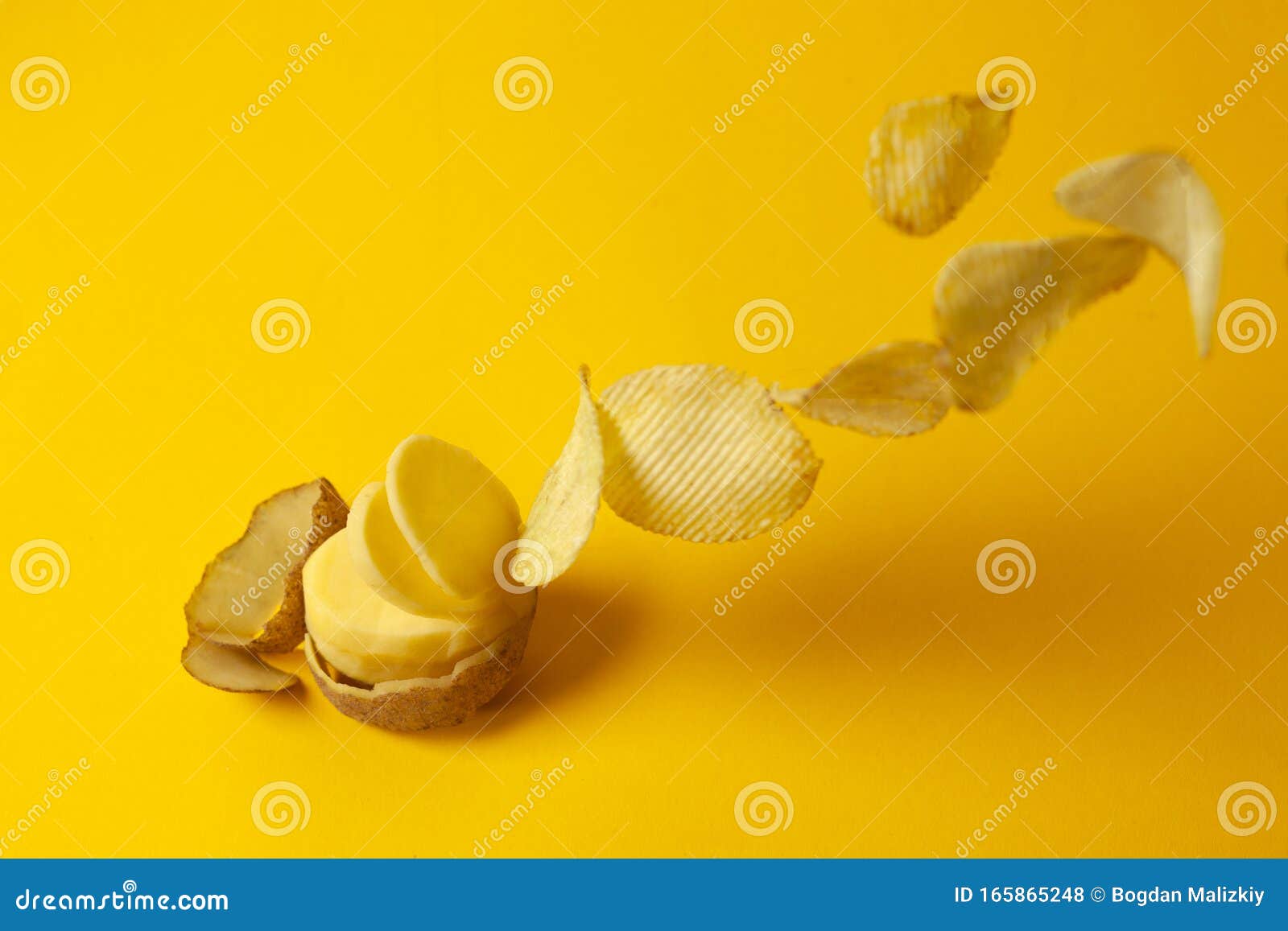 Potato Chips Fly on a Yellow Background, the Process of Making Chips ...