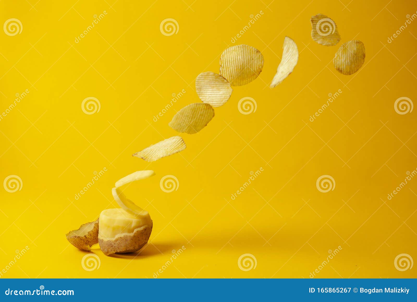 Potato Chips Fly on a Yellow Background, the Process of Making Chips ...