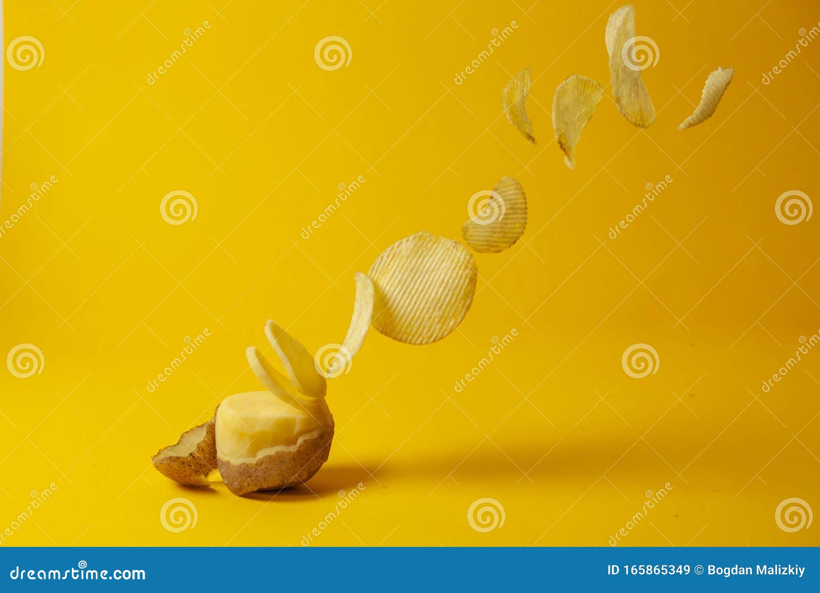 Potato Chips Fly on a Yellow Background, the Process of Making Chips ...