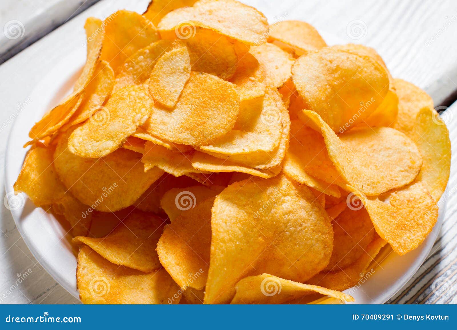 Potato chips on a plate. stock image. Image of popular - 70409291
