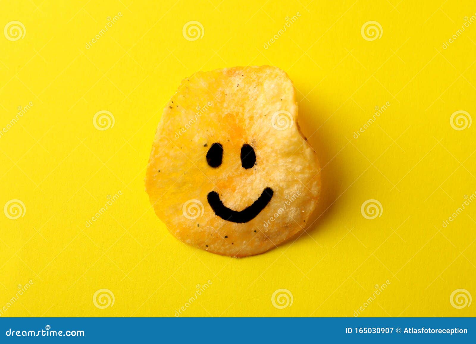 Potato Chips with Smile on Yellow Background, Space for Text Stock ...