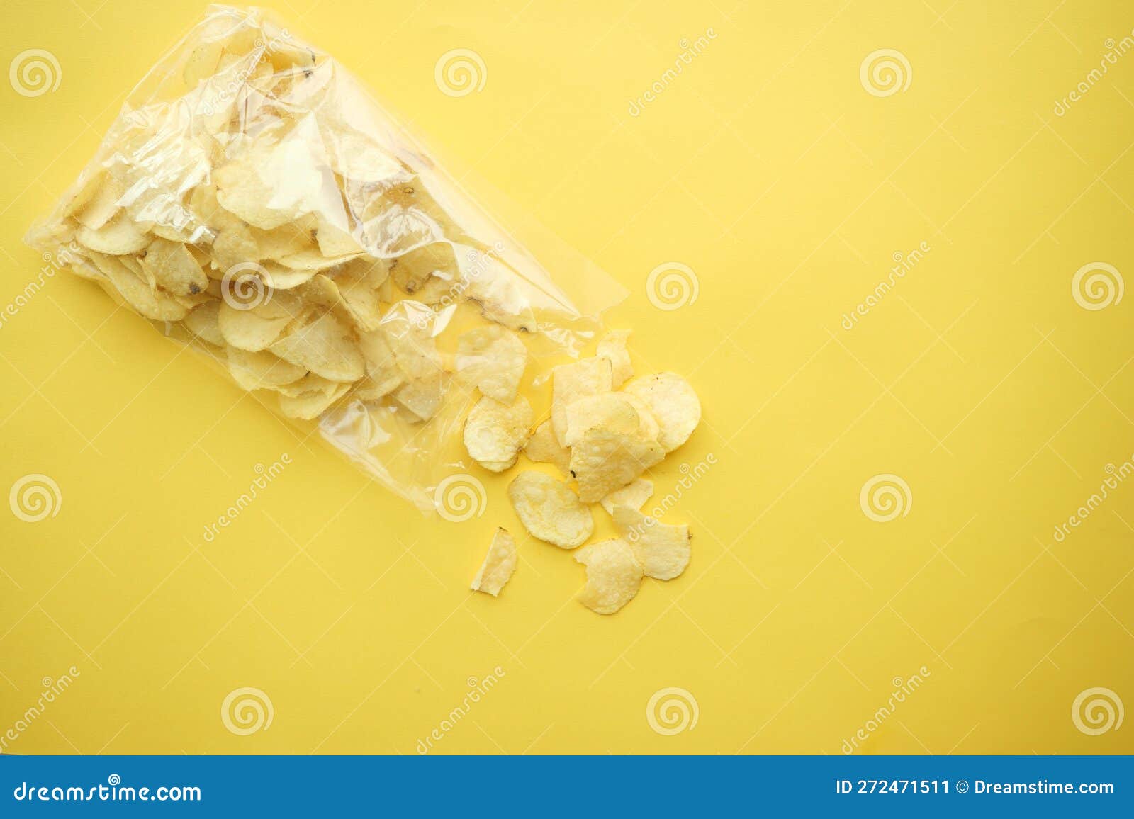 Potato Chips Spilling Form a Packet on Table Stock Image - Image of ...