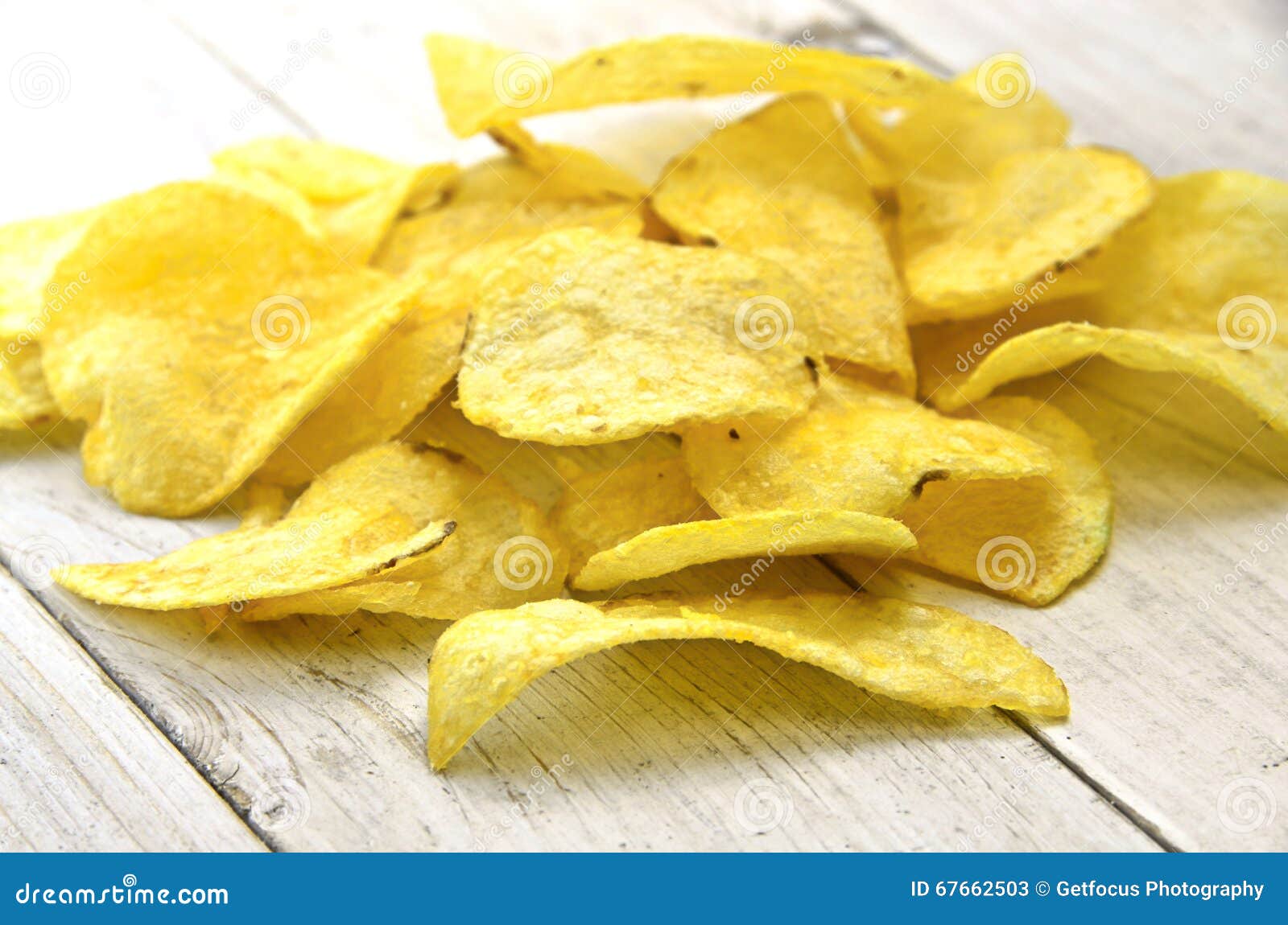 Potato Crispy Chips And Chili Peppers On A Green Background. Stock ...