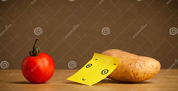 Potato with Post-it Note Looking at Tomato Stock Photo - Image of fresh ...
