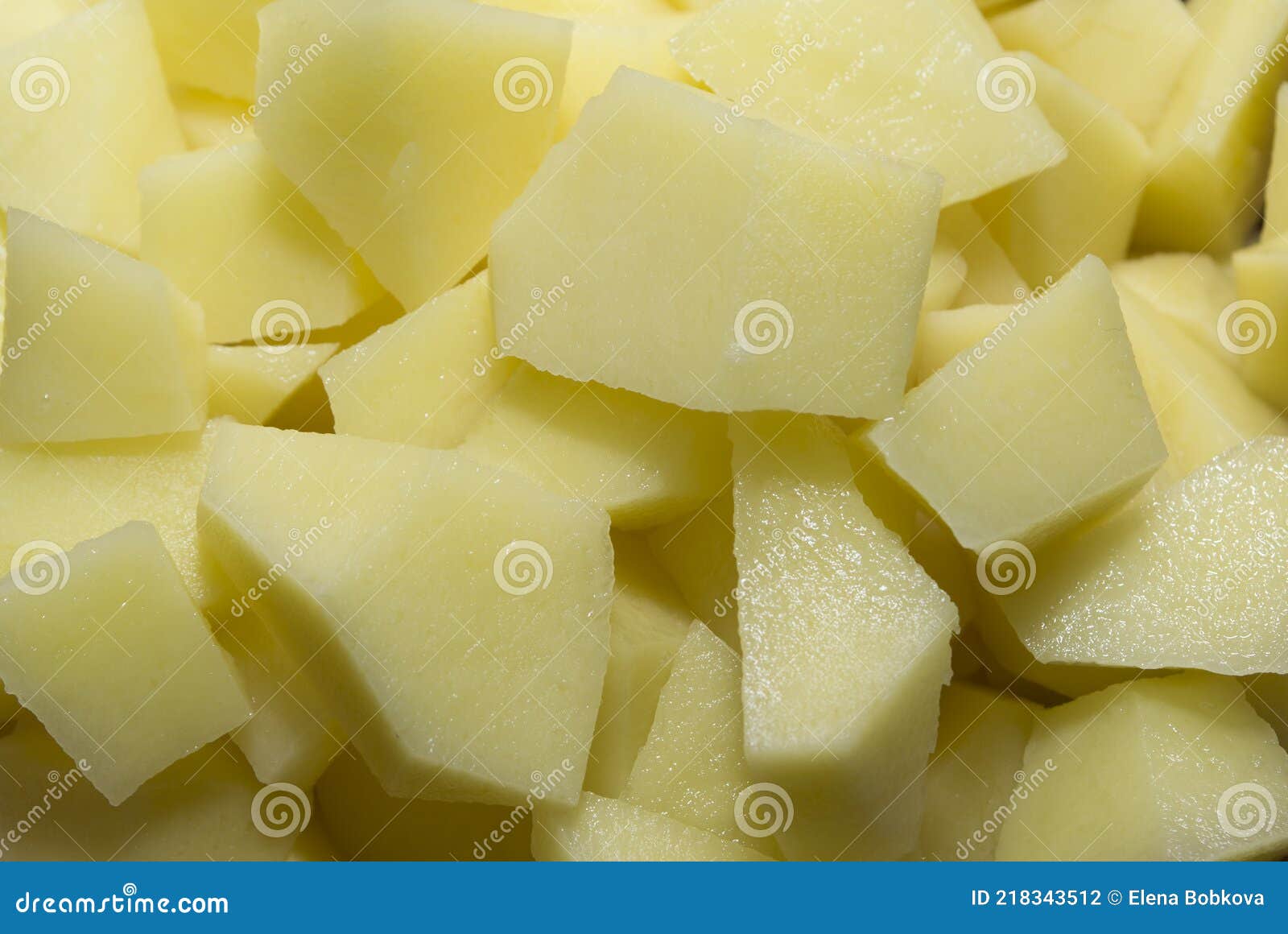 Potatoes Cut into Yellow Pieces, Texture Background. Stock Photo ...