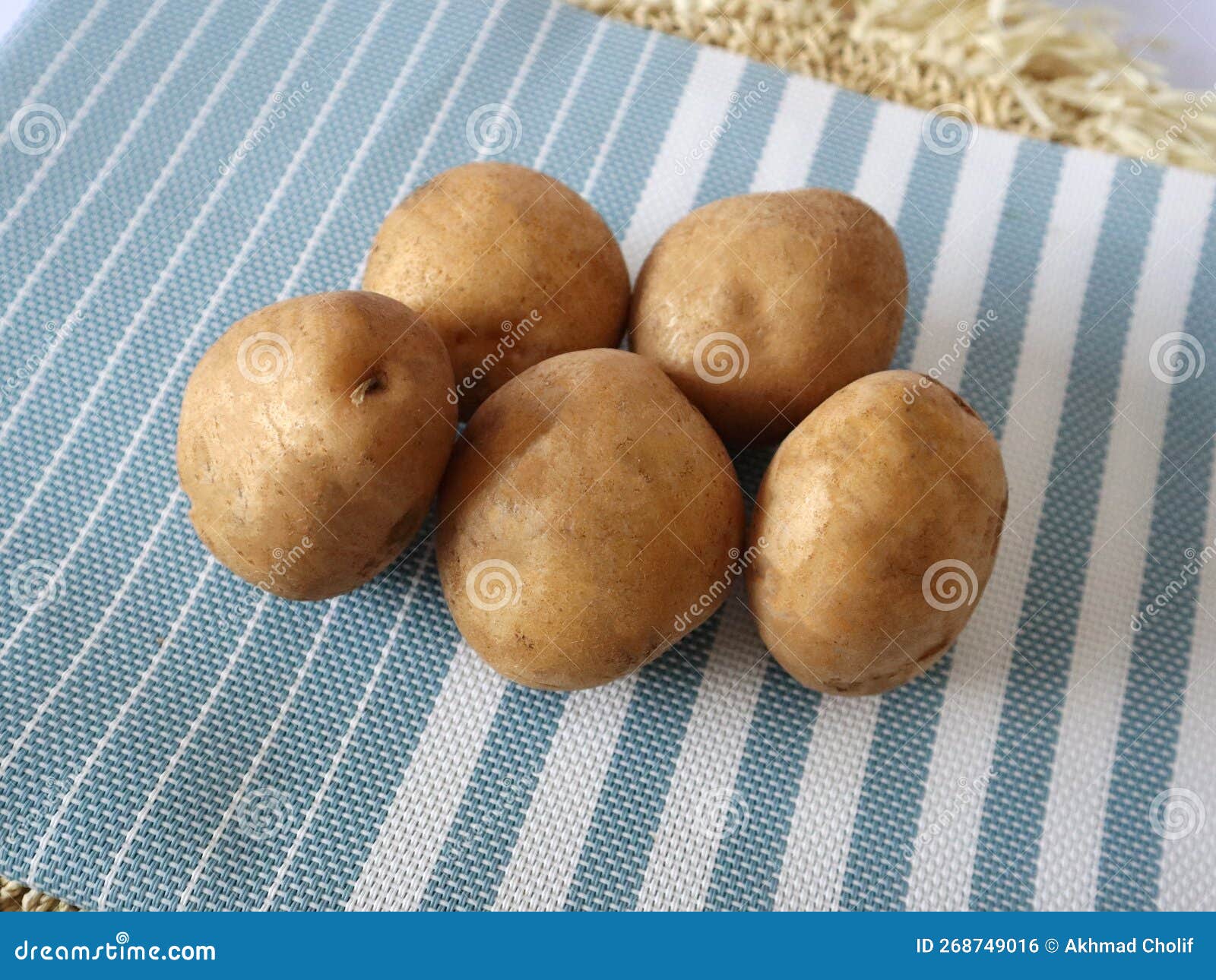 Fresh Medium Size Potatoes on a Plate Stock Photo - Image of backdrop ...
