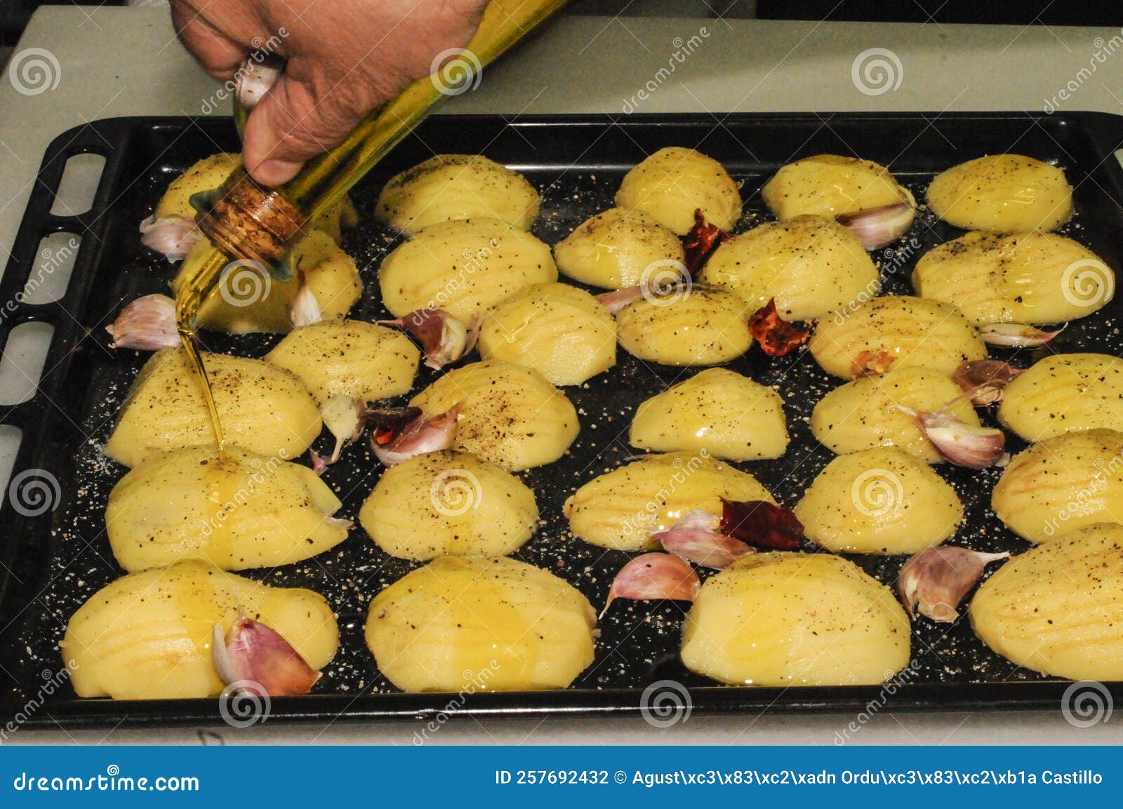 Potatoes with Ridges, Garlic and Olive Oil on a Baking Tray. Stock ...