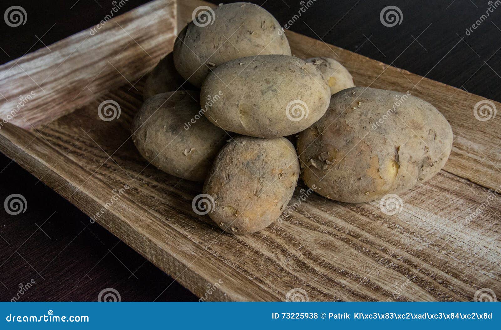 Potatoes on wood tray stock photo. Image of ingredient - 73225938