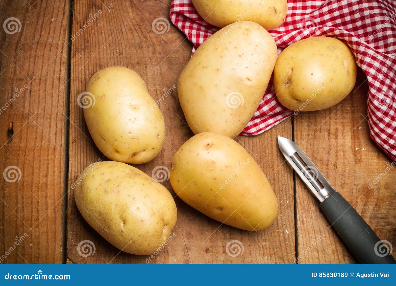 Potatoes on a wooden table stock image. Image of food - 85830189