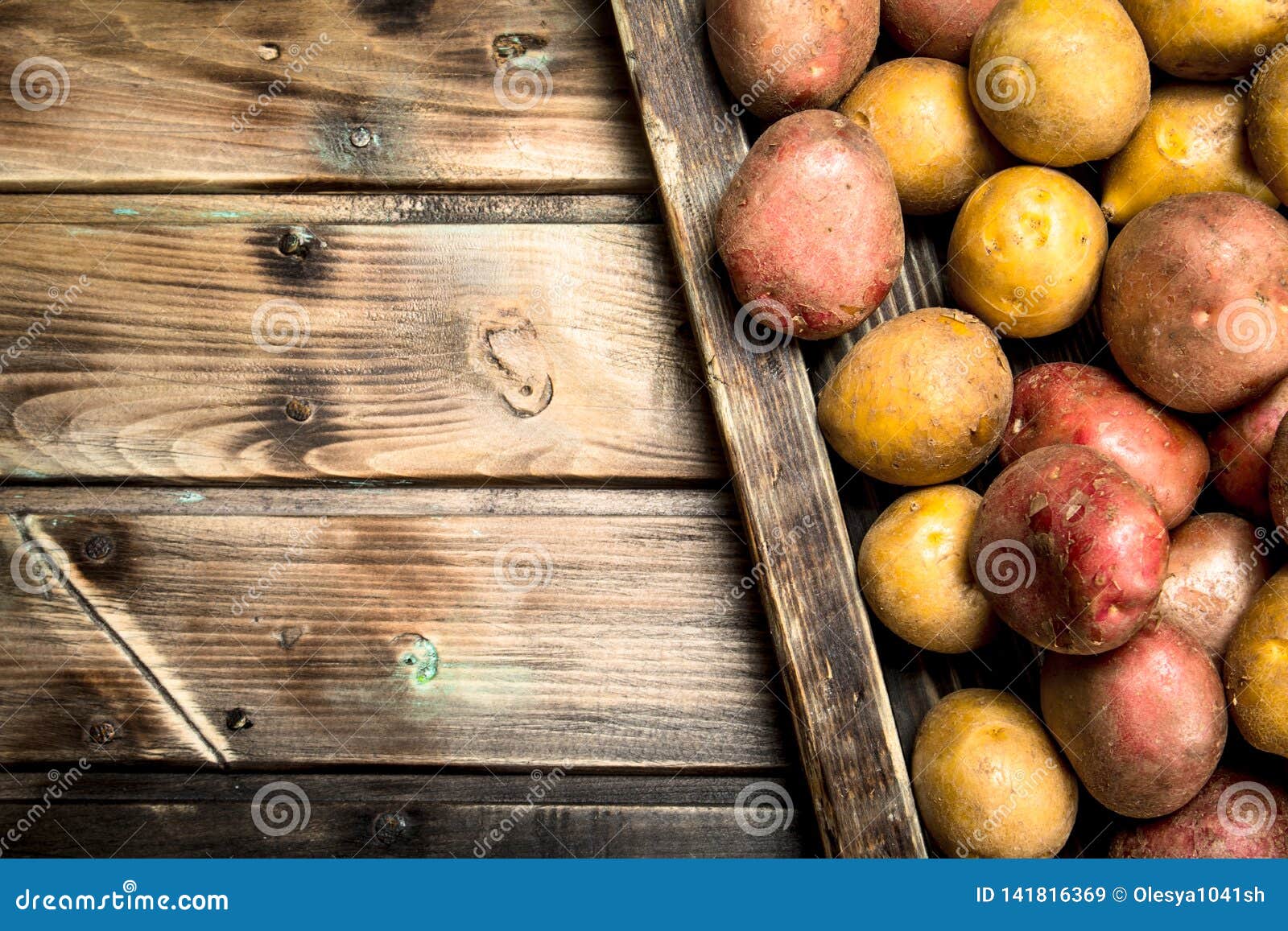 Potatoes on a wooden tray stock image. Image of potato - 141816369