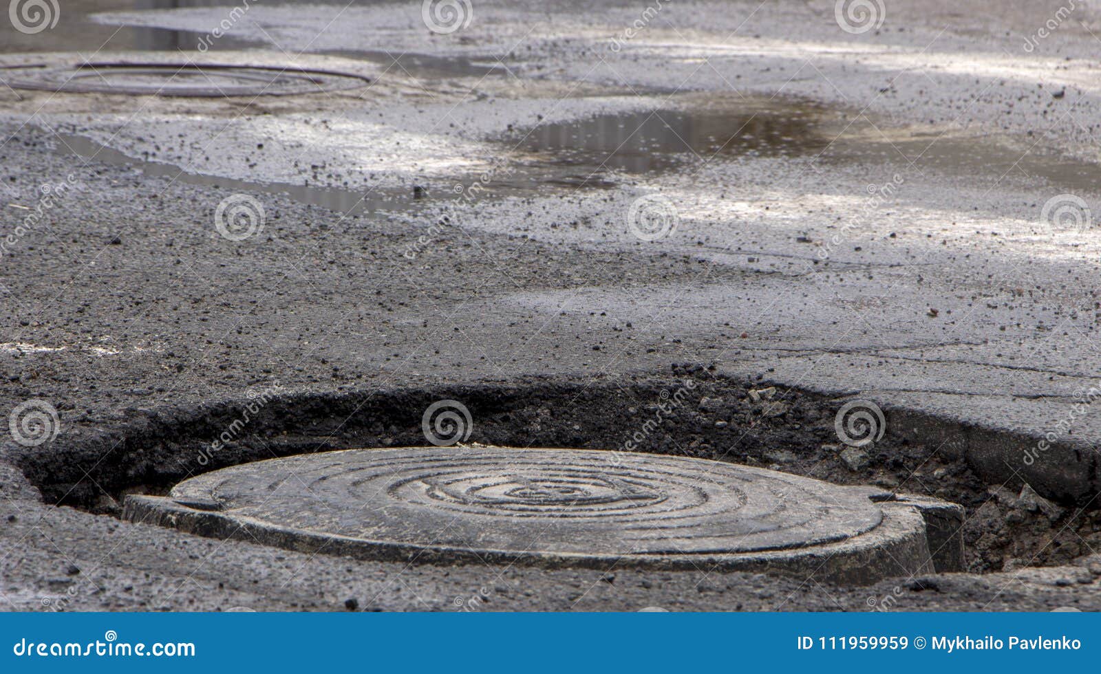 Pothole On Asphalt Closeup With Blue And Gray Stones. Background ...