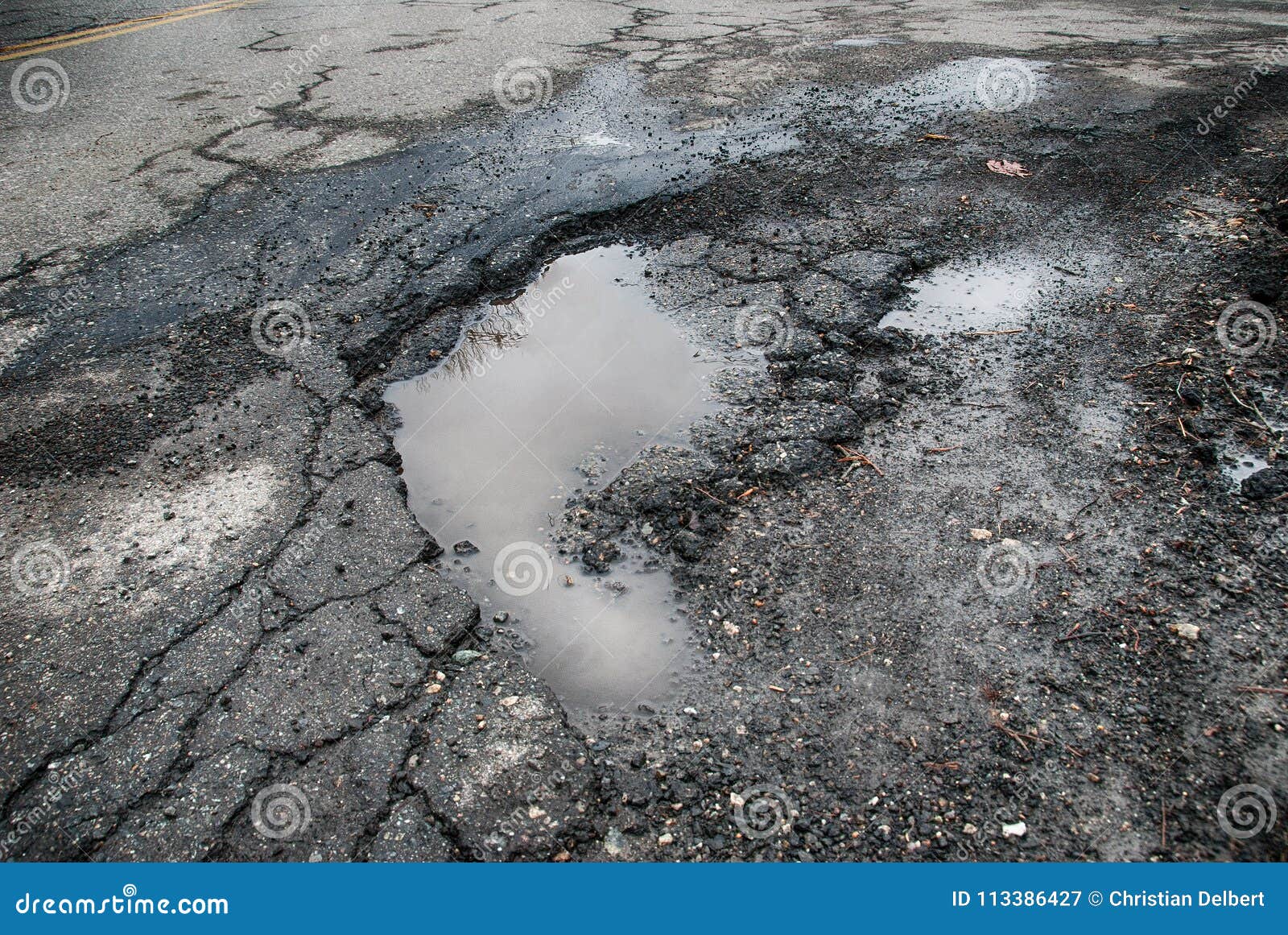 Pothole in asphalt road stock image. Image of hole, spring - 113386427