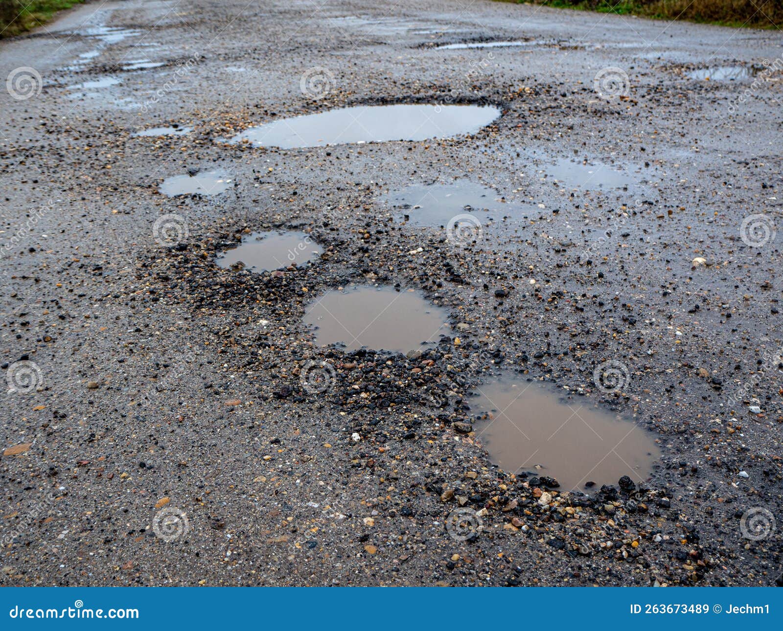 Pothole on a Paved Road on a Rainy Winter Day. Concept of Risk and ...
