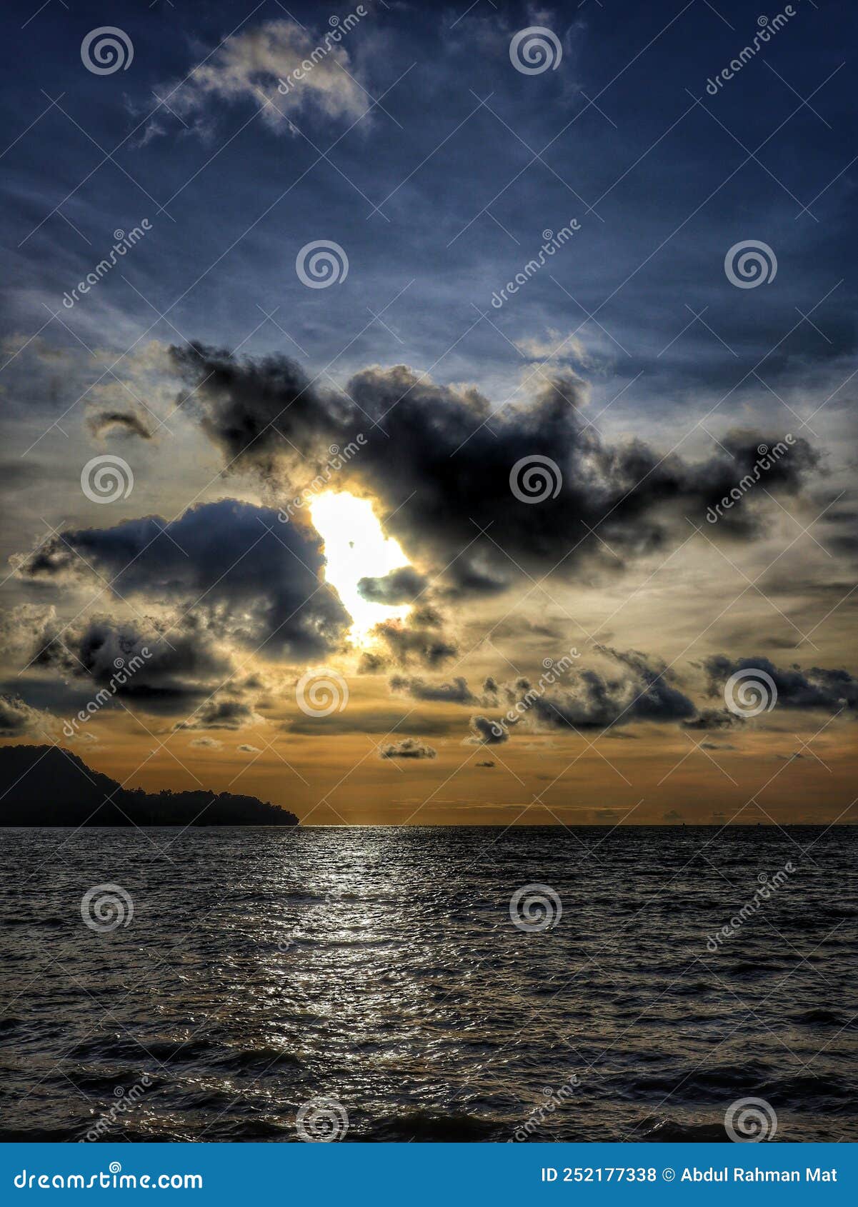Potrait of cloudy sunset stock photo. Image of coast - 252177338