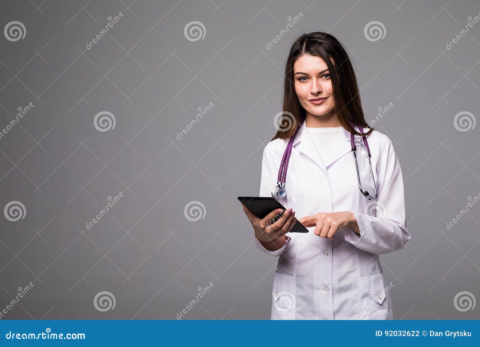 Potrait of a Smiling Female Doctor or Nurse Using Tablet Pc Computer ...