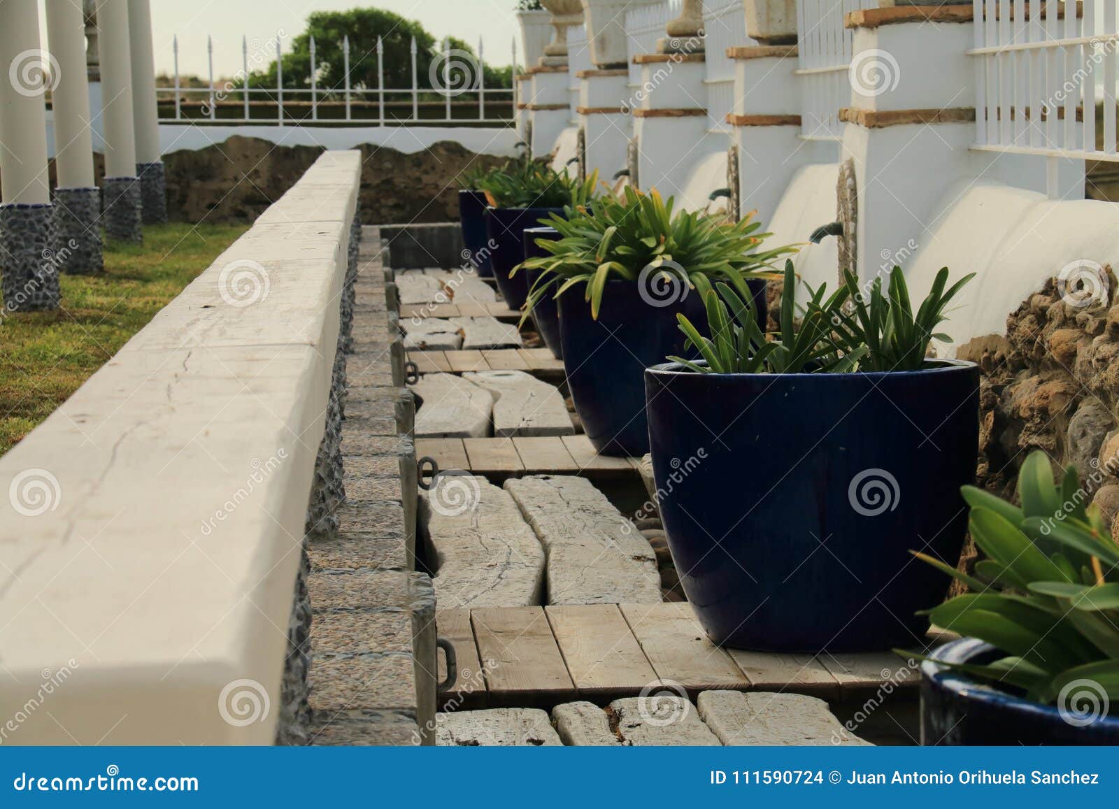Pots along the wooden path stock photo. Image of architecture - 111590724