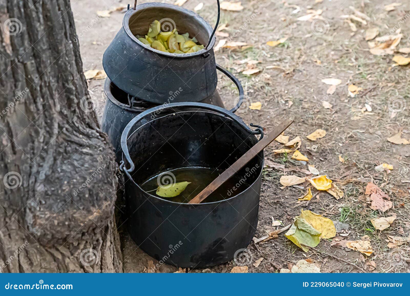 Pots for Cooking on a Fire Stand on the Ground, Walking Around Utensil ...