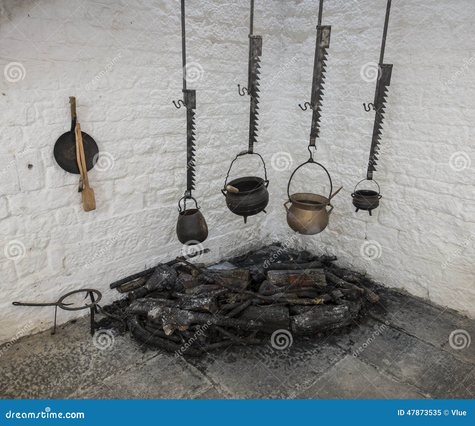 Pots hanging over a fire stock image. Image of cookware - 47873535