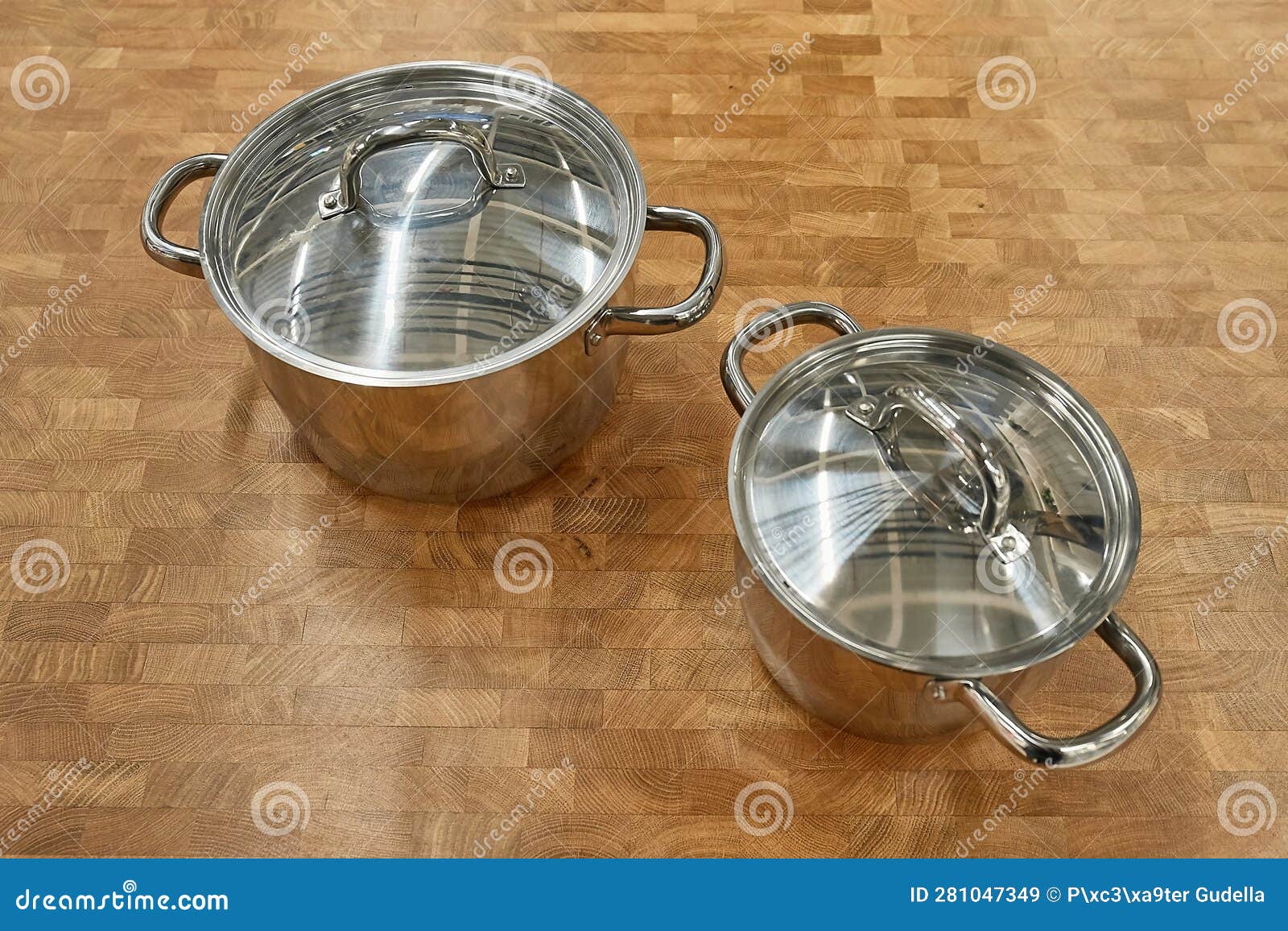 Pots on a kitchen counter stock image. Image of shiny - 281047349