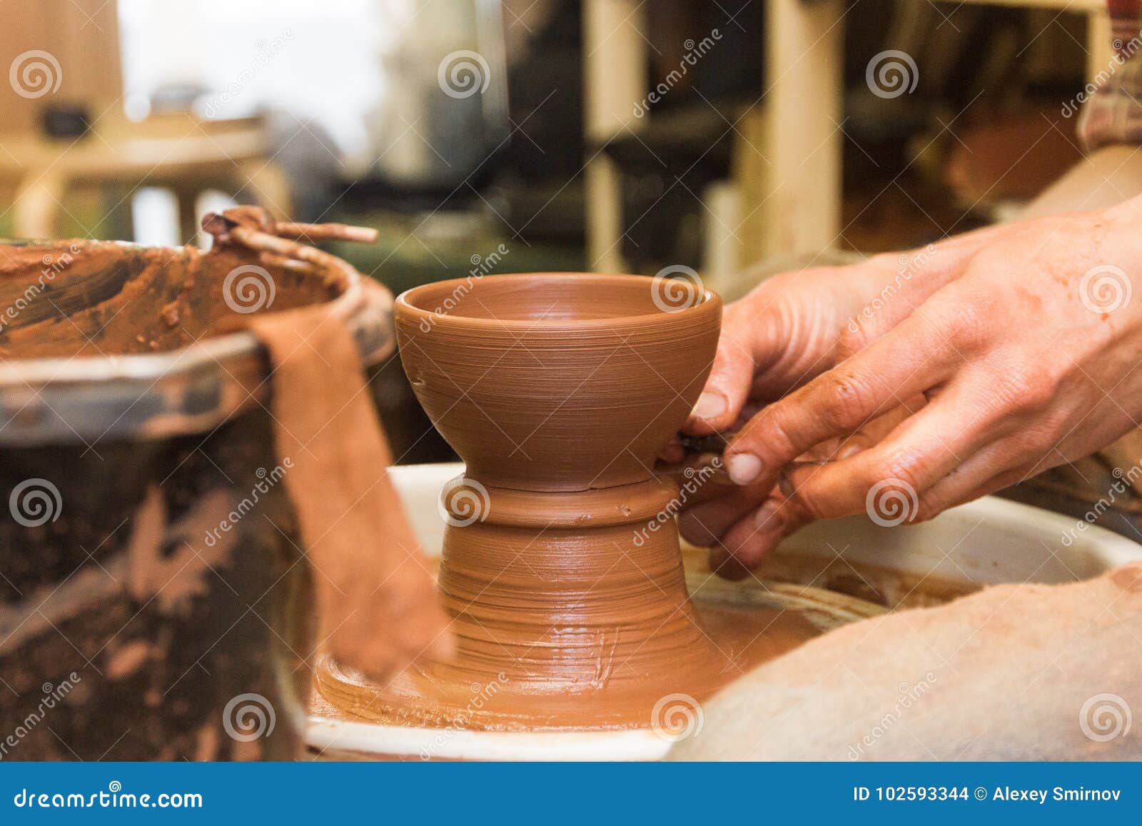 Potter doing his work stock photo. Image of pottery - 102593344