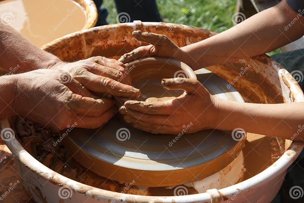 Potter Master and Apprentice Stock Photo - Image of instructor, adult ...
