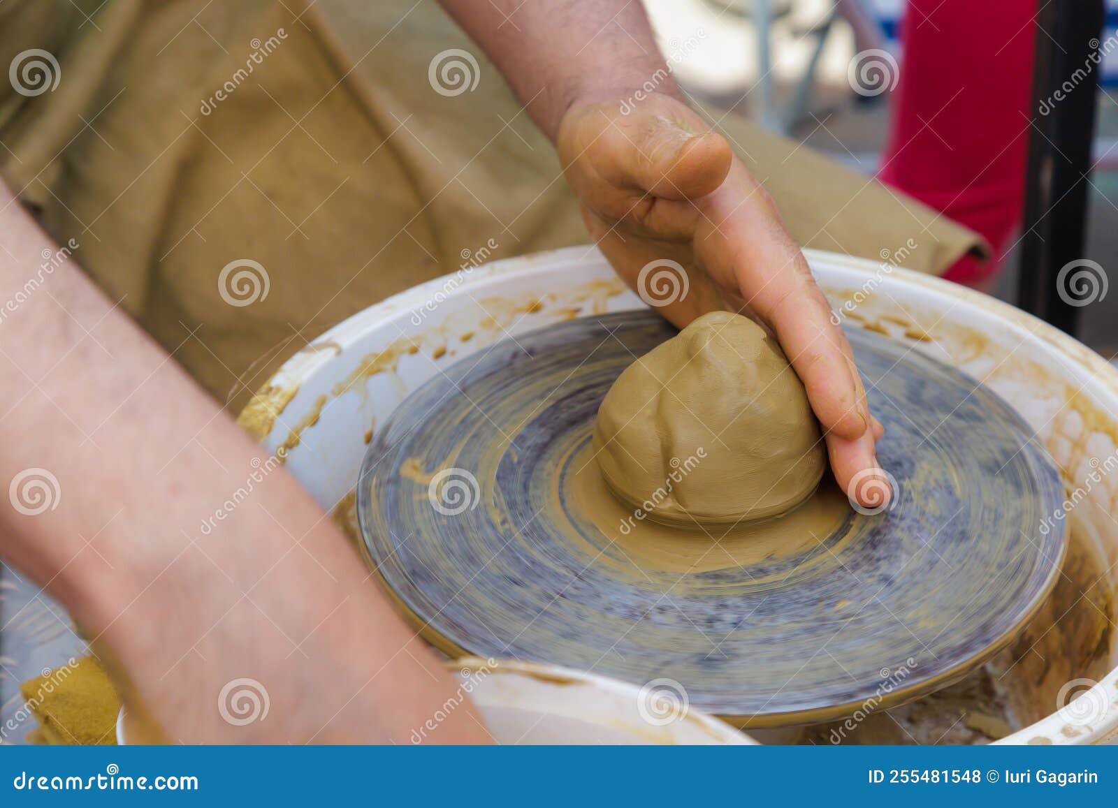 Potter in the Process of Working on a Potters Wheel. Close-up Hands ...