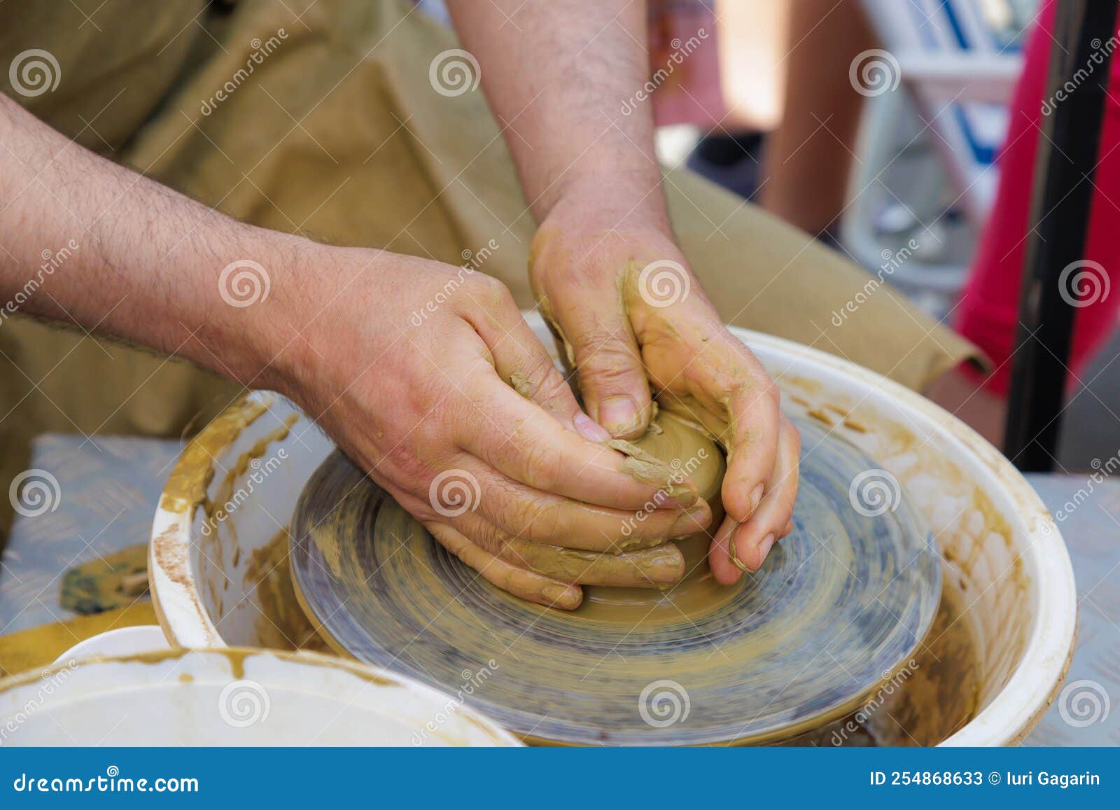 Potter in the Process of Working on a Potters Wheel. Close-up Hands ...