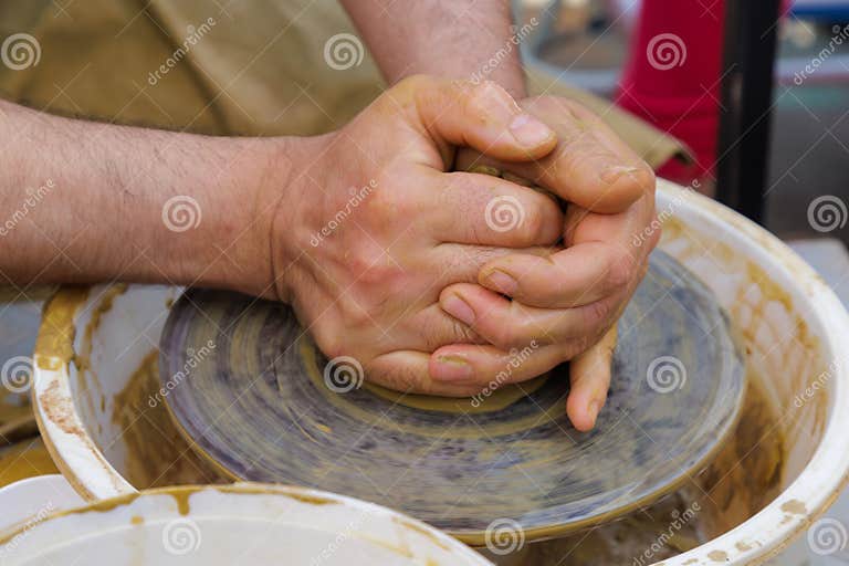 Potter in the Process of Working on a Potters Wheel. Close-up Hands ...