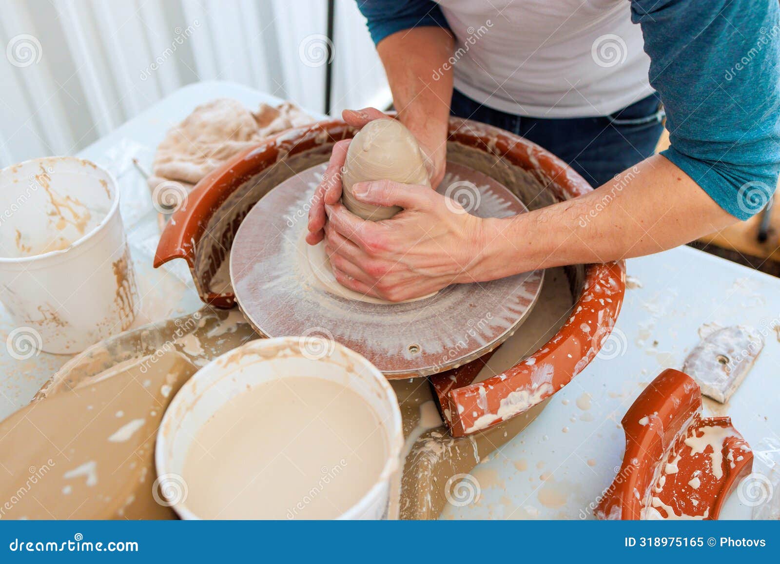 In a Potter Wheel, Wet Hands Sculpt Soft Clay As Potter Creates Clay ...