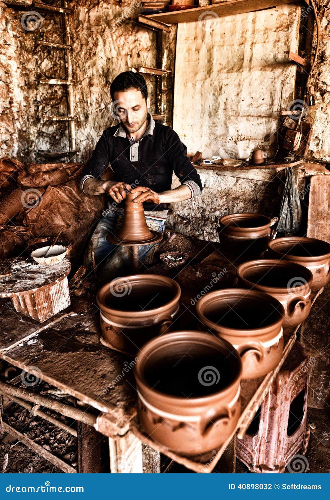 The potter working editorial photography. Image of company - 40898032