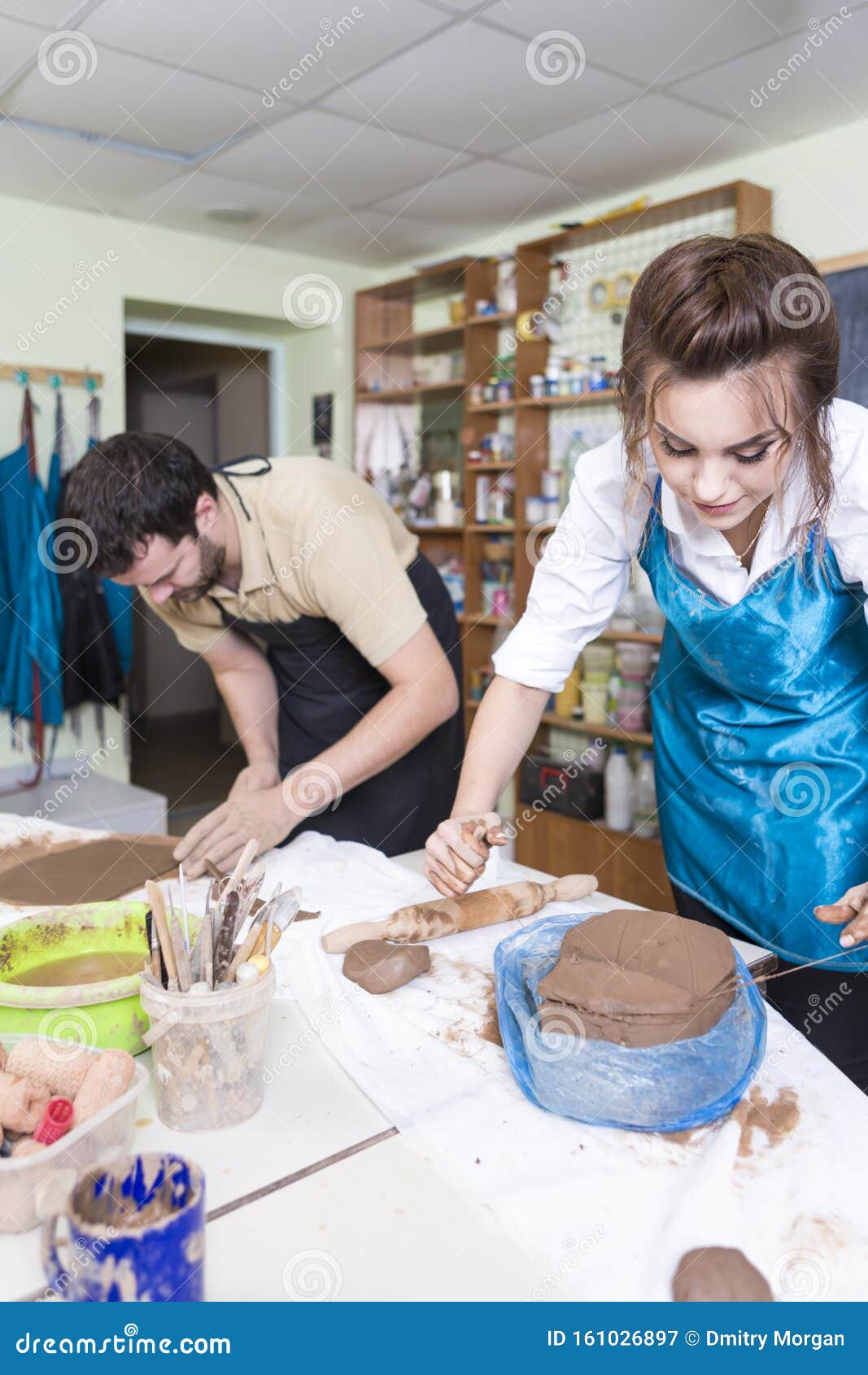 Pottering and Claymaking Process Concept. Two Professional Ceramists or ...