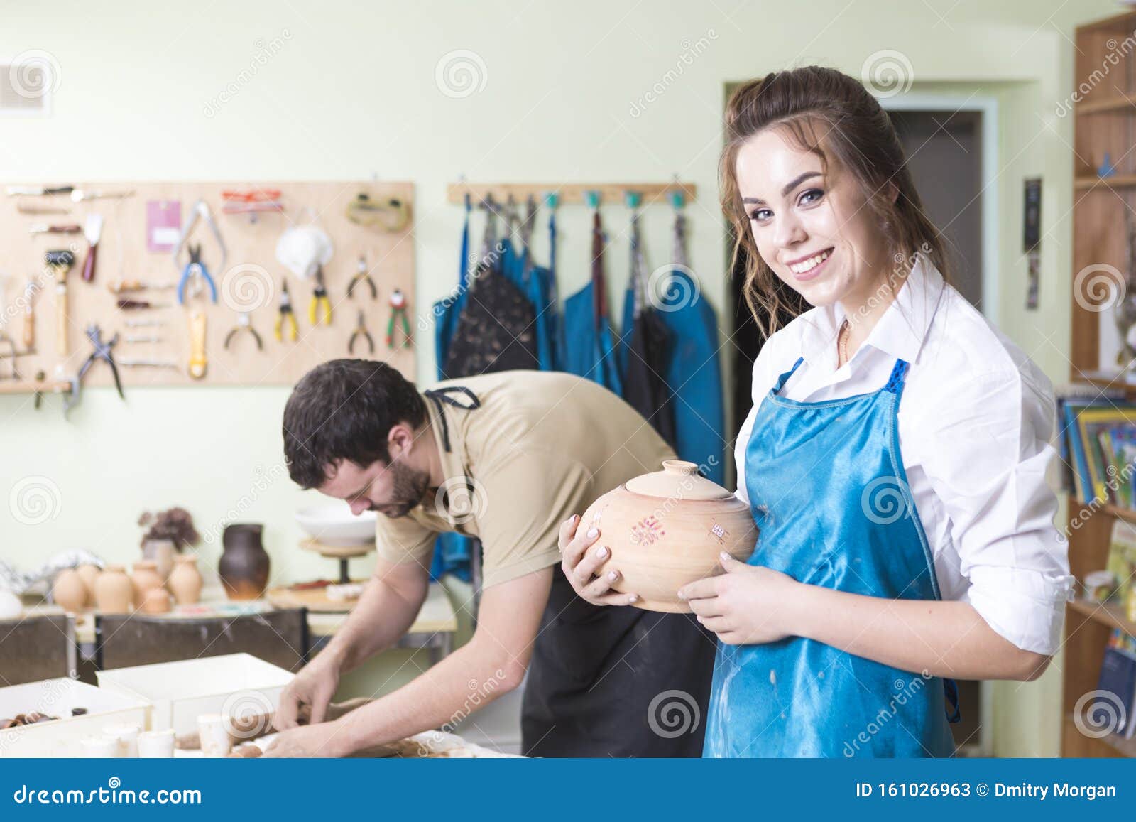 Pottering Concept. Professional Ceramists during a Working Process in ...