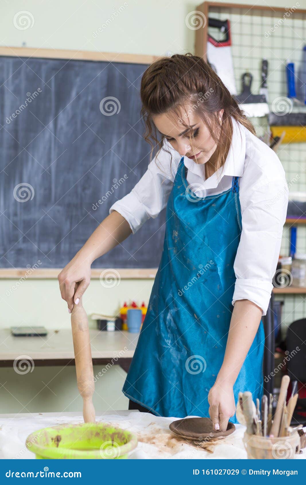 Pottering Concepts. Professional Female Potter Preparing A Piece Of Raw ...