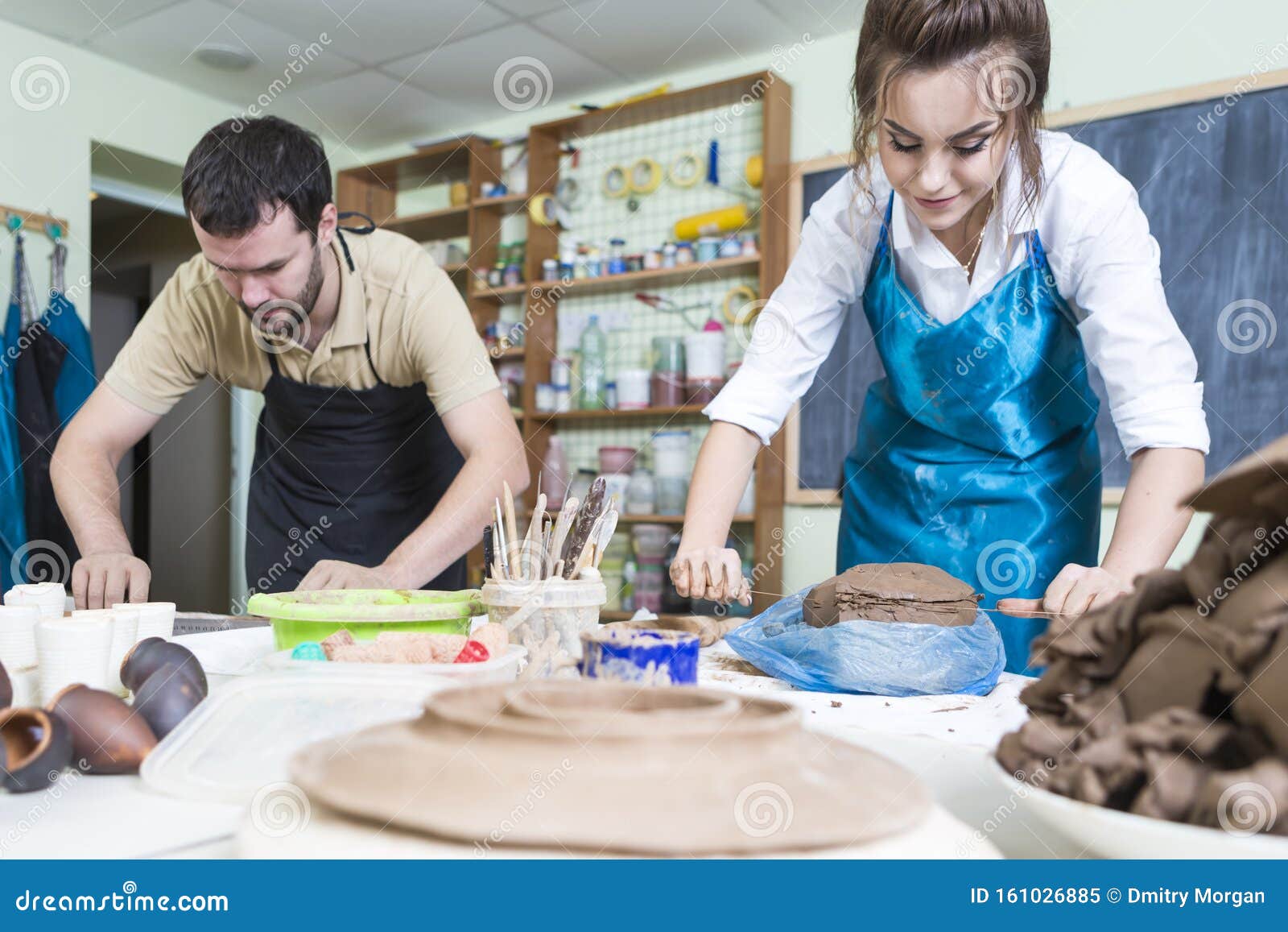 Pottering Process Concept. Two Professional Ceramists or Claymakers ...