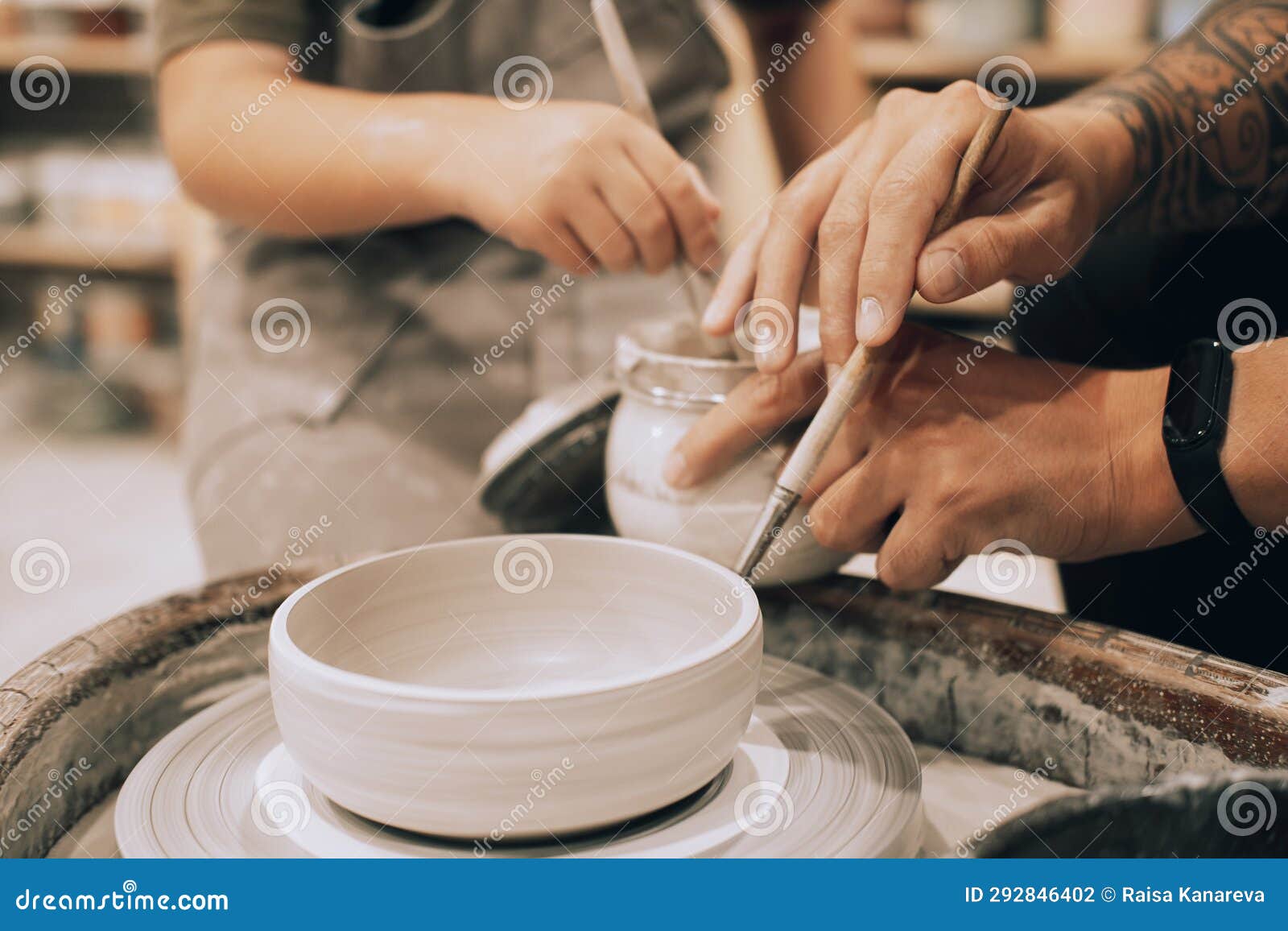 Confident Young Man and Little Boy Making Ceramic Pot on the Pottery ...
