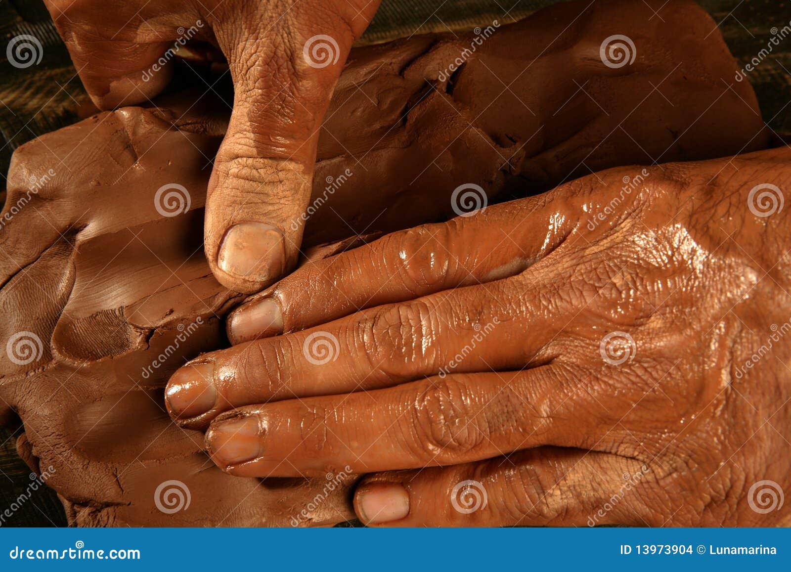 Work With Red Clay. Male Hands Form A Bowl On A Spinning Pottery Wheel ...