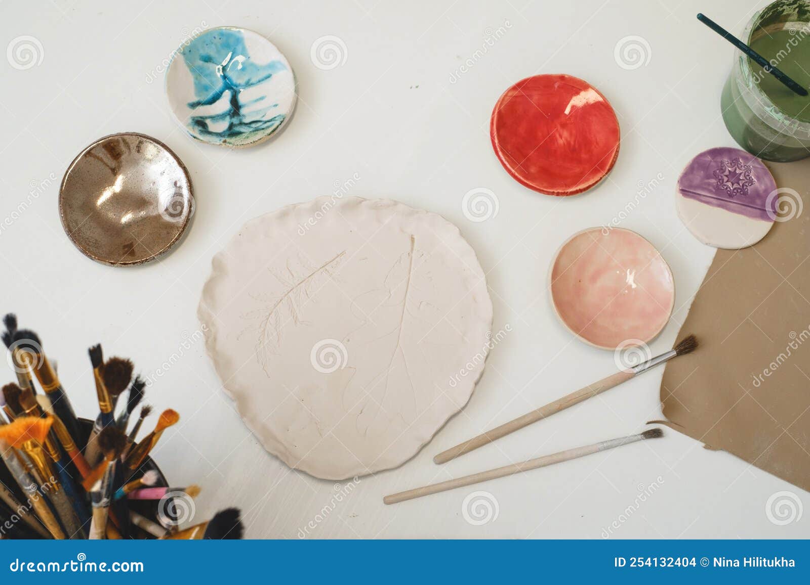 Pottery Plate before Glazing, Painting on Plate in Workshop, Top View ...